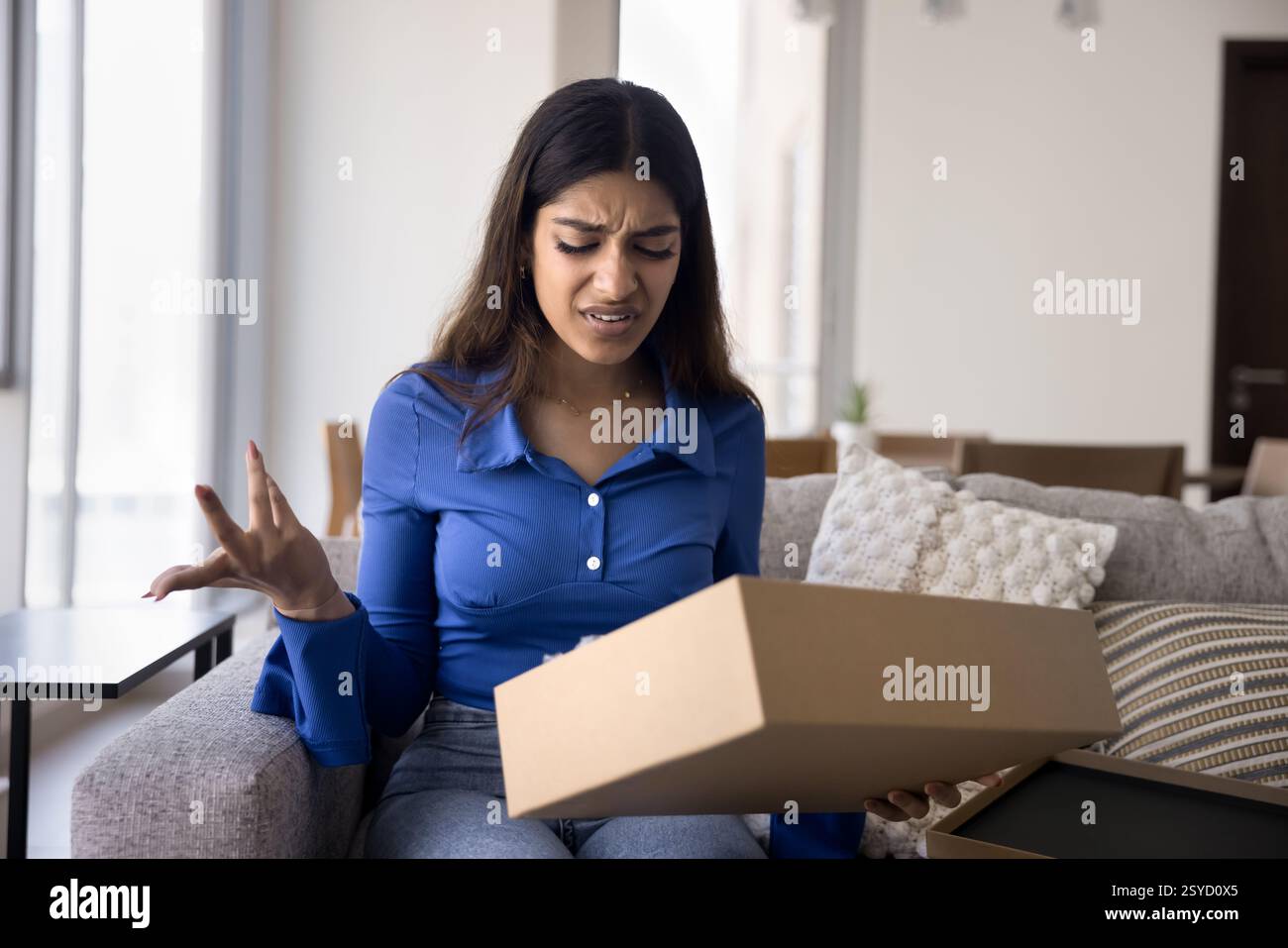 Woman opens cardboard box hi-res stock photography and images - Alamy