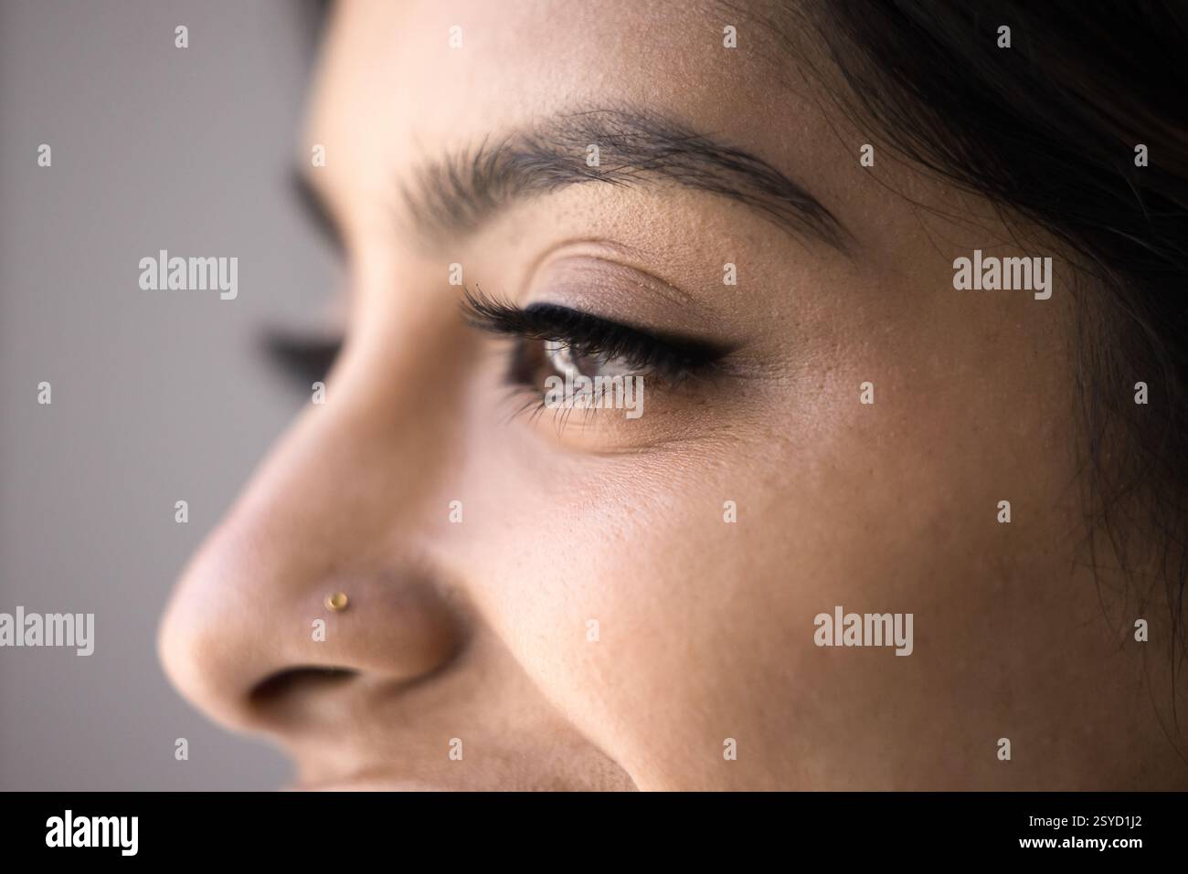 Close-up profile view of young Indian woman face Stock Photo - Alamy