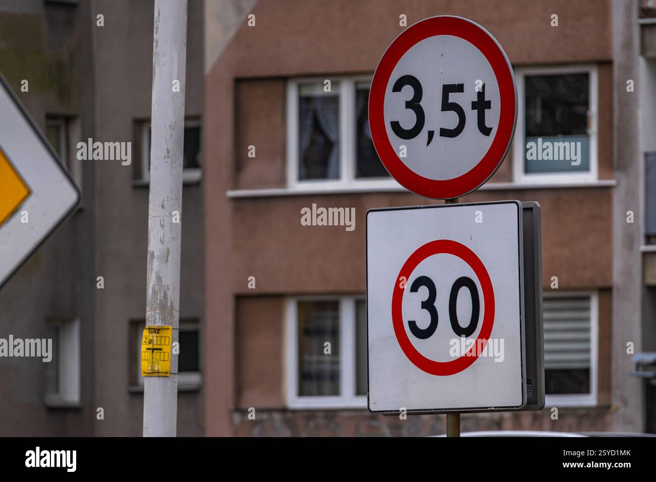 Sign informing about the speed limit for motor vehicles in the city, maximum speed 30 kilometers ...
