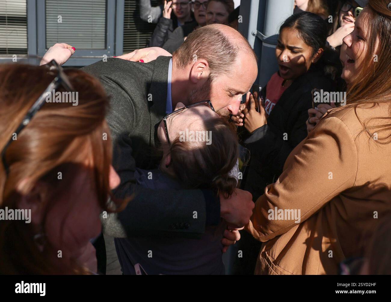 The Prince of Wales hugs well-wisher Natasha Gorry during his visit to ...