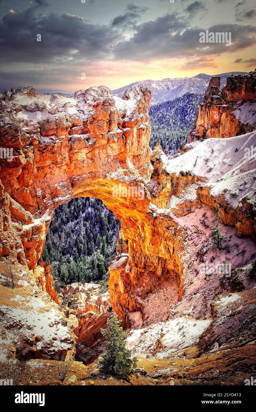 Early winter sunlight reflects off of Natural Bridge in Bryce Canyon ...