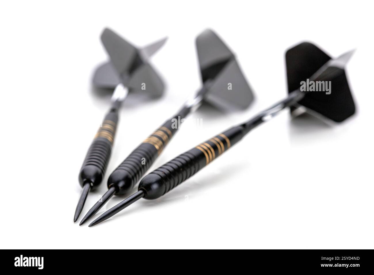 Three black darts are placed on a white background with the tips of the ...