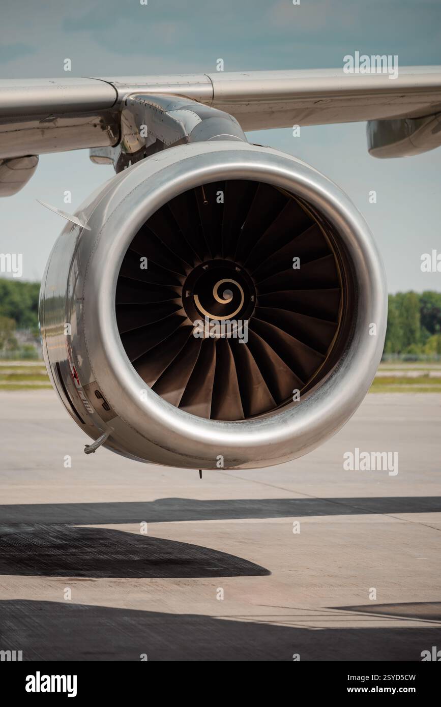 Front view of turbofan engine under a wing of passenger aircraft ...