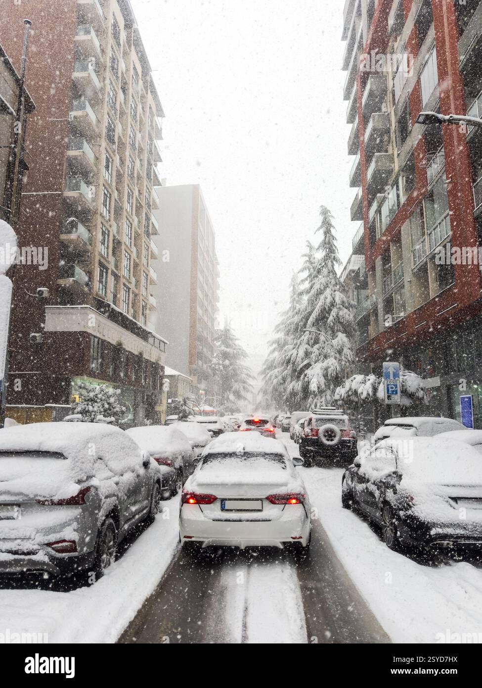 Heavy snowfall in Batumi Georgia covering cars streets and buildings ...