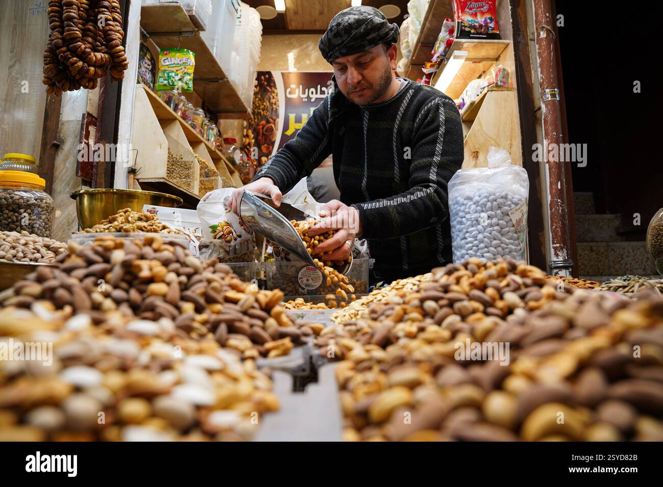 A cherry seller seen in his shop at the Bab Al-Saray market ahead of ...