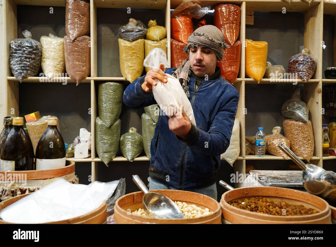 A spice seller seen in his shop at the Bab Al-Saray market ahead of the ...
