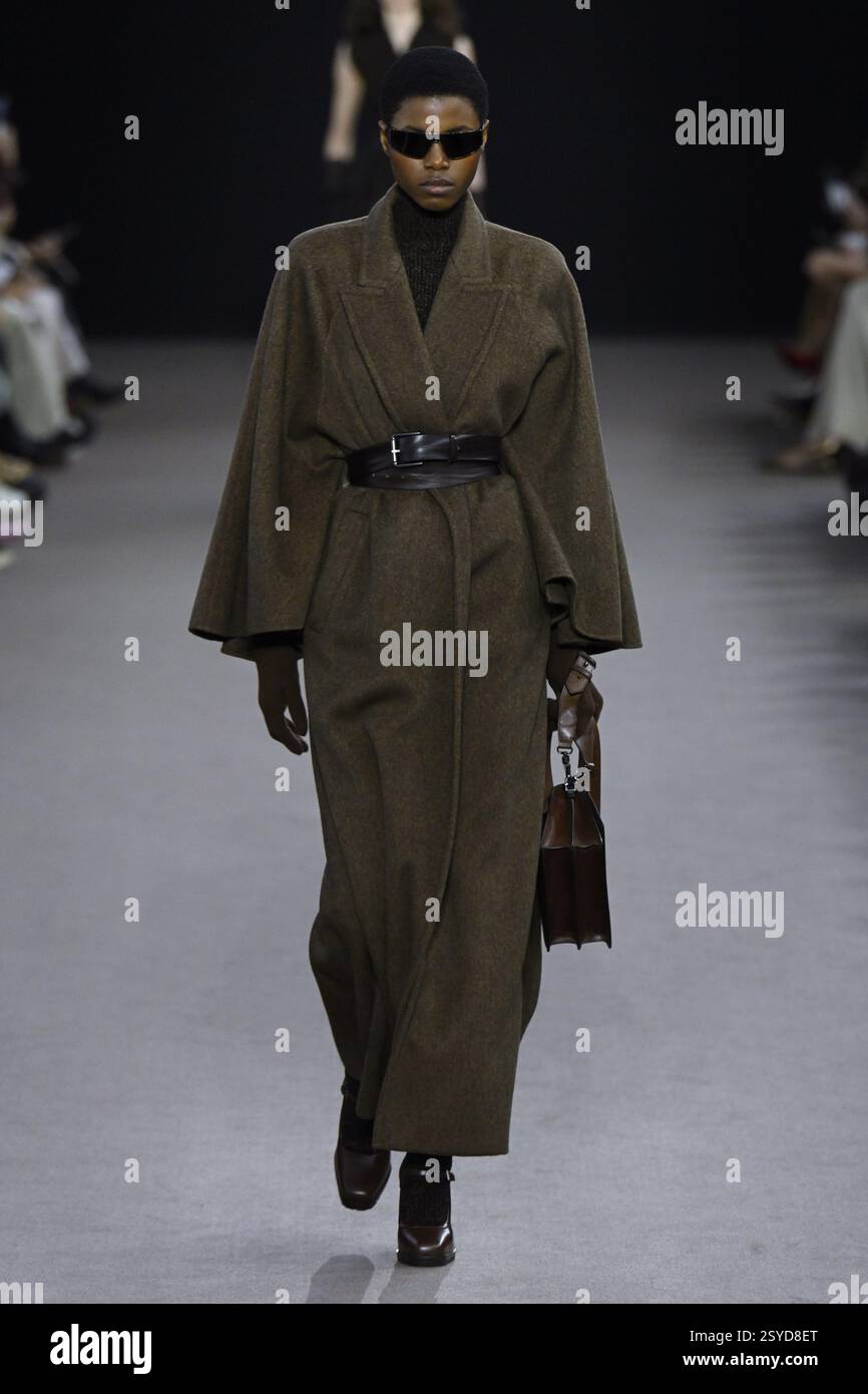Milan, Italy. 27th Feb, 2025. Model Victoria Fawole walks on the runway ...