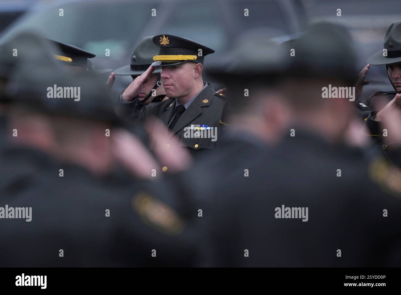 Officers salute the procession as the remains of West York Borough ...