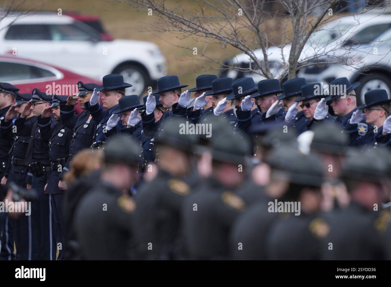 Officers salute the procession as the remains of West York Borough ...