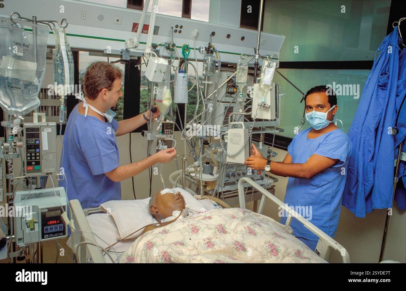 Brazil, Sao Paulo. Nurses in the intensive care unit provide care to a ...