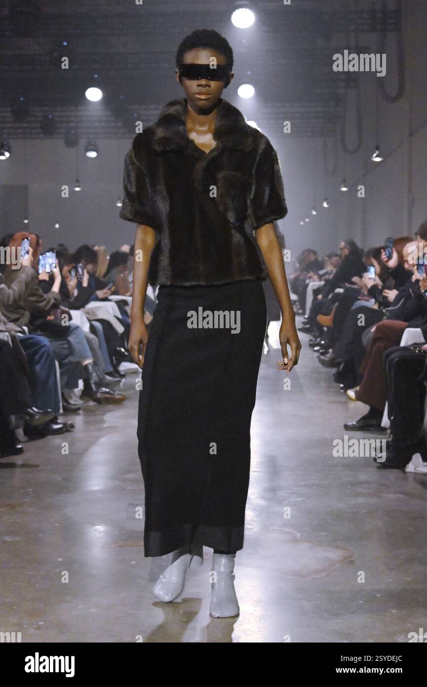 Model Binta Diop walks on the runway during the MM6 Ready to Wear ...