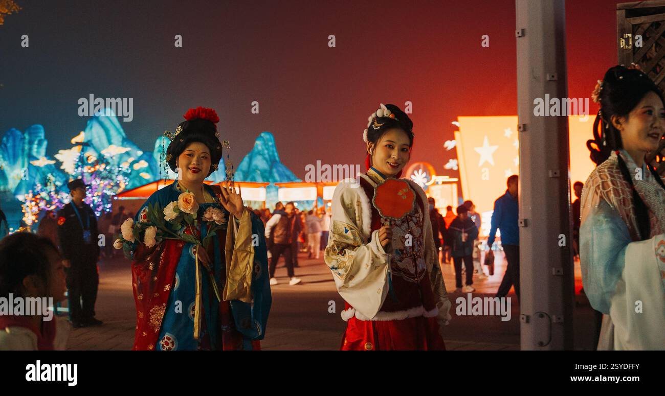 Beijing, China. Pretty Women In Traditional Chinese Dresses Holding ...