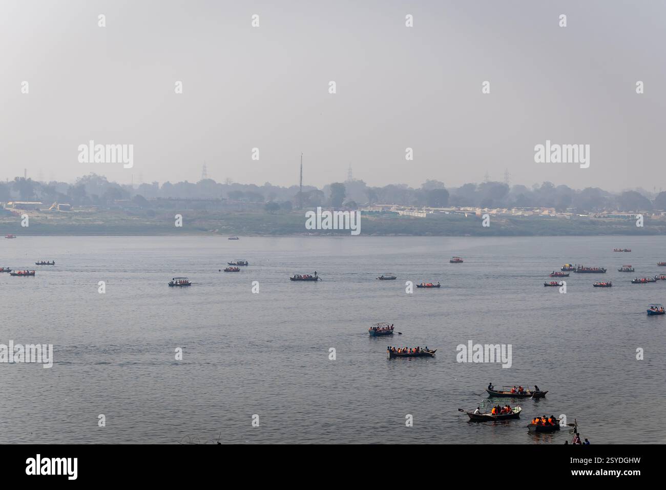 pilgrims on boat crossing sacred ganges river for triveni sangam at ...