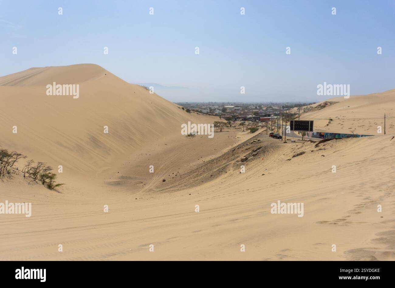 Huacachina Oasis surrounded by golden sand dunes in the Ica desert Peru ...
