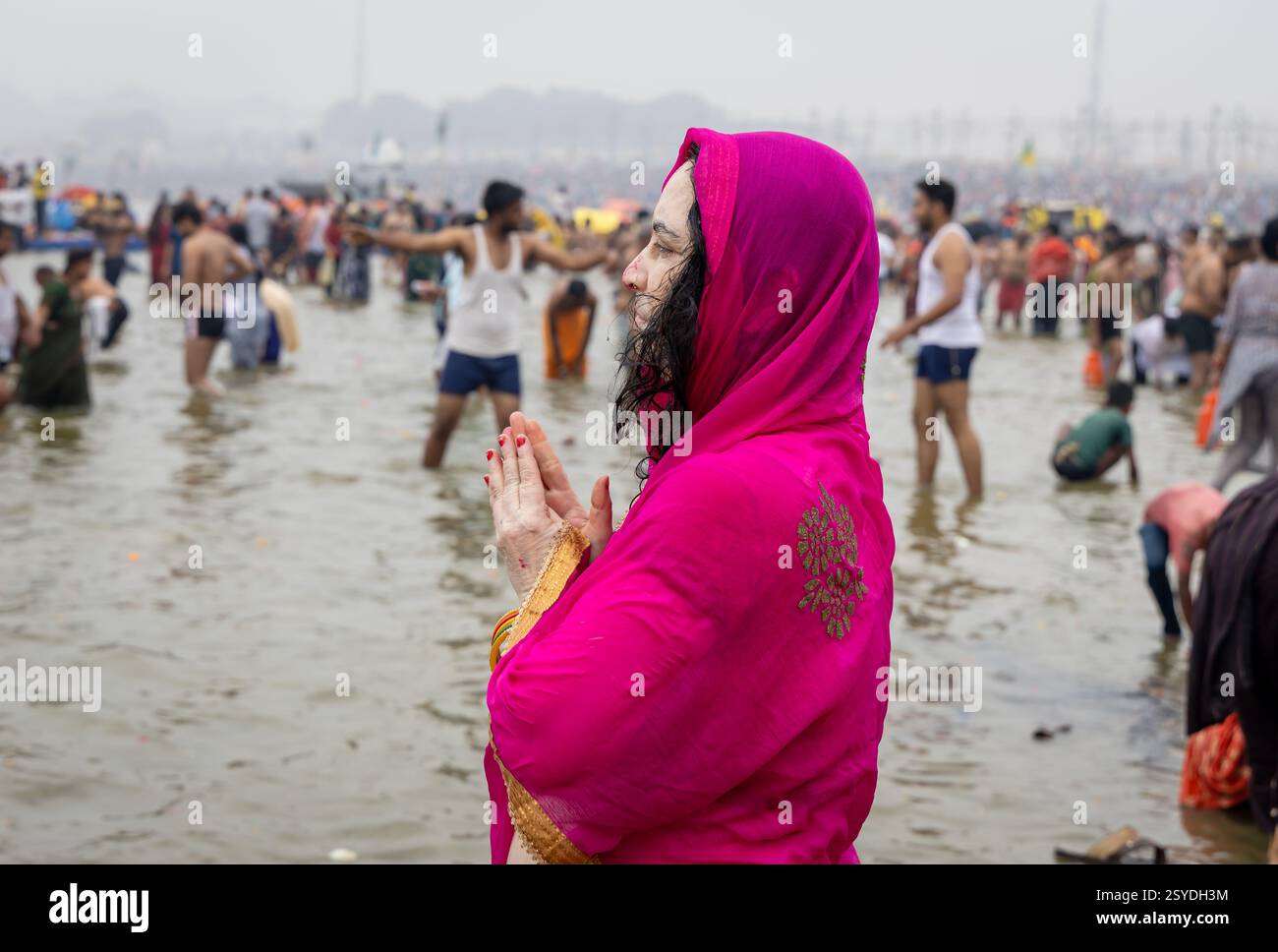 sacred devotees offering holy pryer at triveni sangam at mahakumbh ...