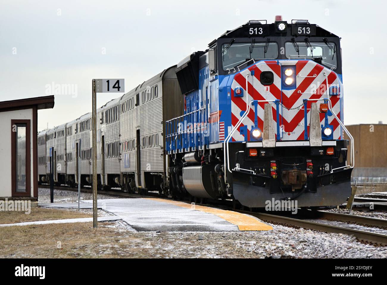 Franklin Park, Illinois, USA. A westbound Metra commuter train, outbound from Chicago, passing a ...