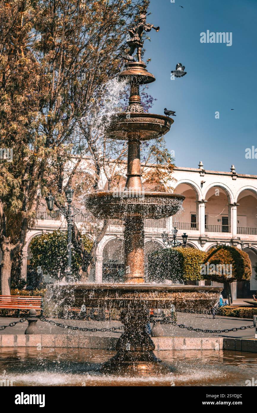 The Plaza de Armas of Arequipa Peru features colonial architecture lush ...