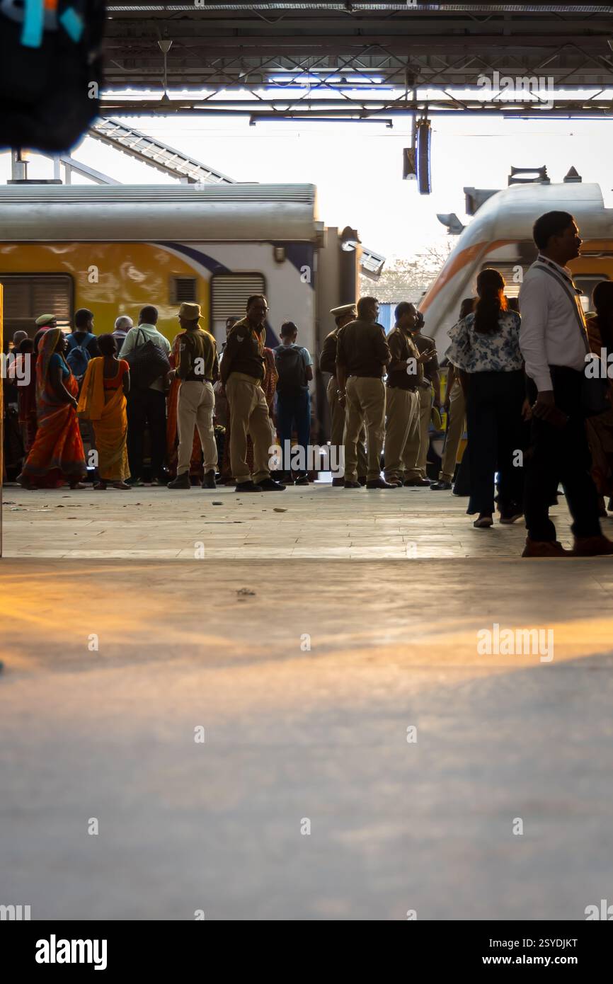 police and railway authorities controlling crowd at platform during ...