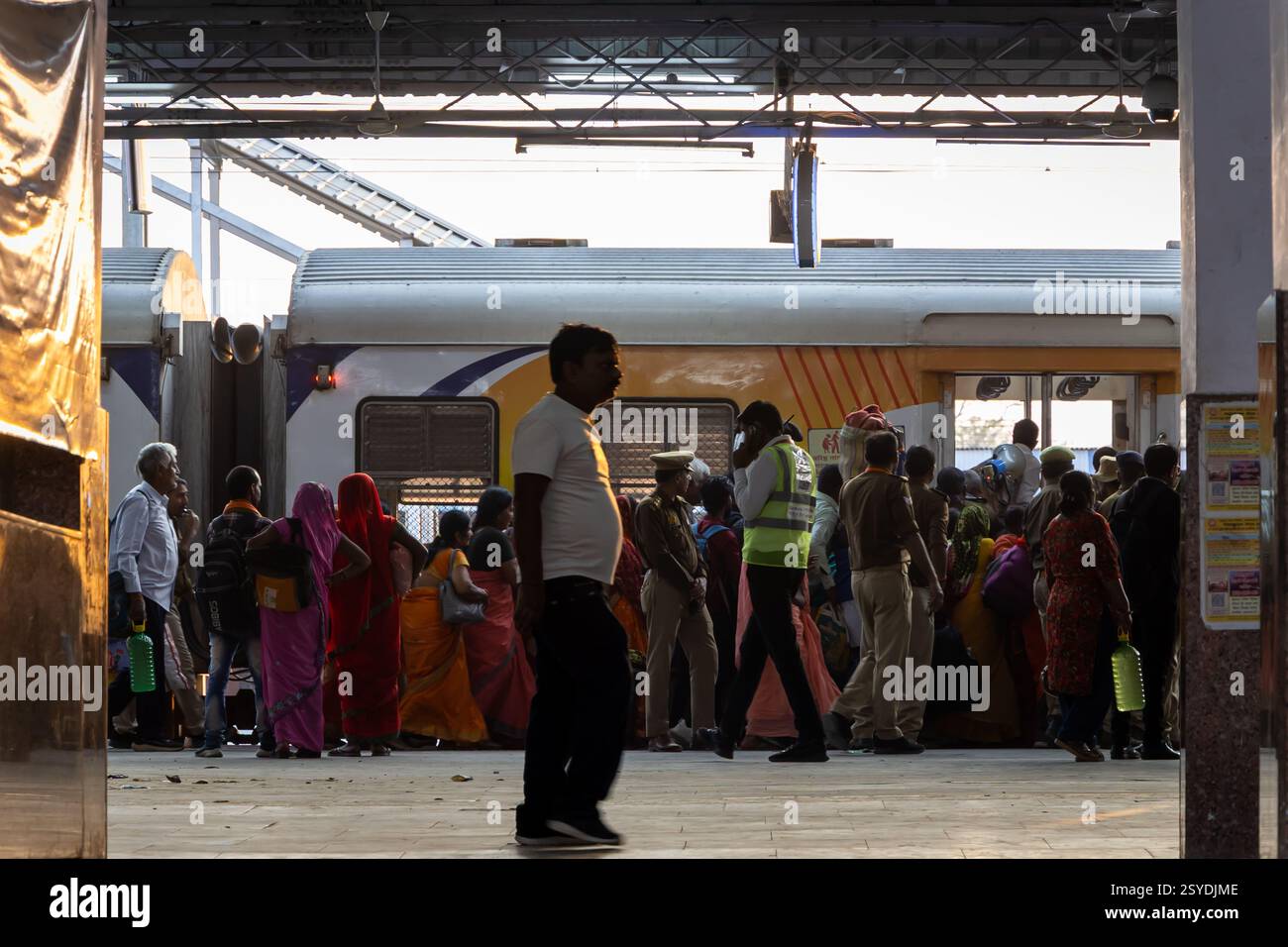 police and railway authorities controlling crowd at platform during ...