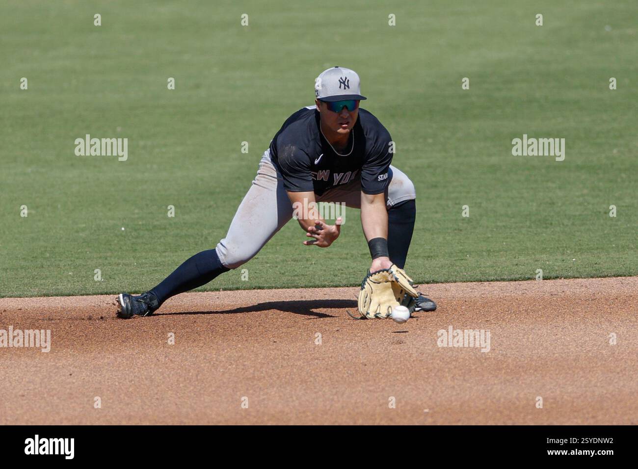 Clearwater, FL: New York Yankees shortstop Anthony Volpe (11) fields ...