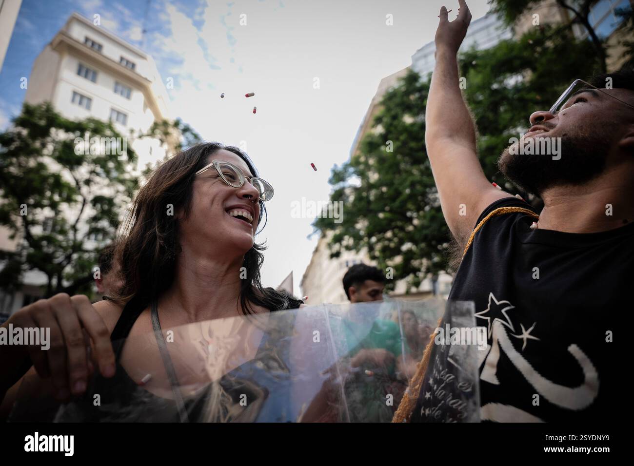 Health care workers shove pills in the air during the rally. Federal ...