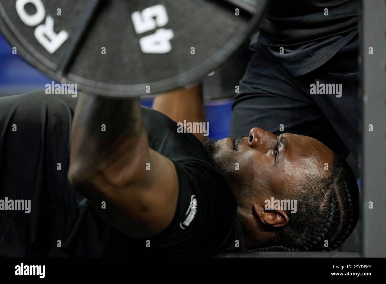 Oregon linebacker Jeffrey Bassa lifts weights at the NFL football ...