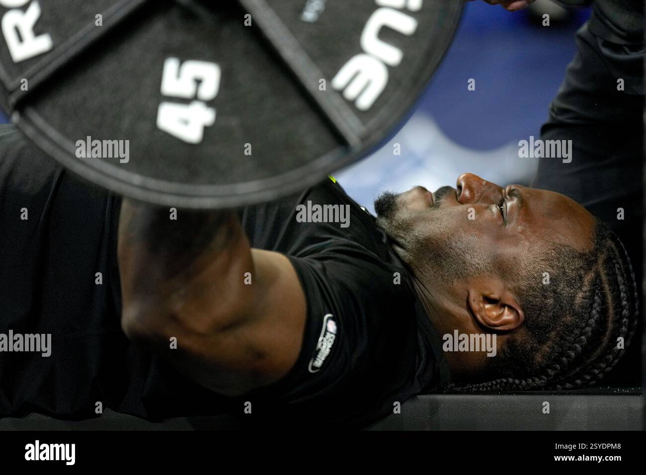 Oregon linebacker Jeffrey Bassa lifts weights at the NFL football ...