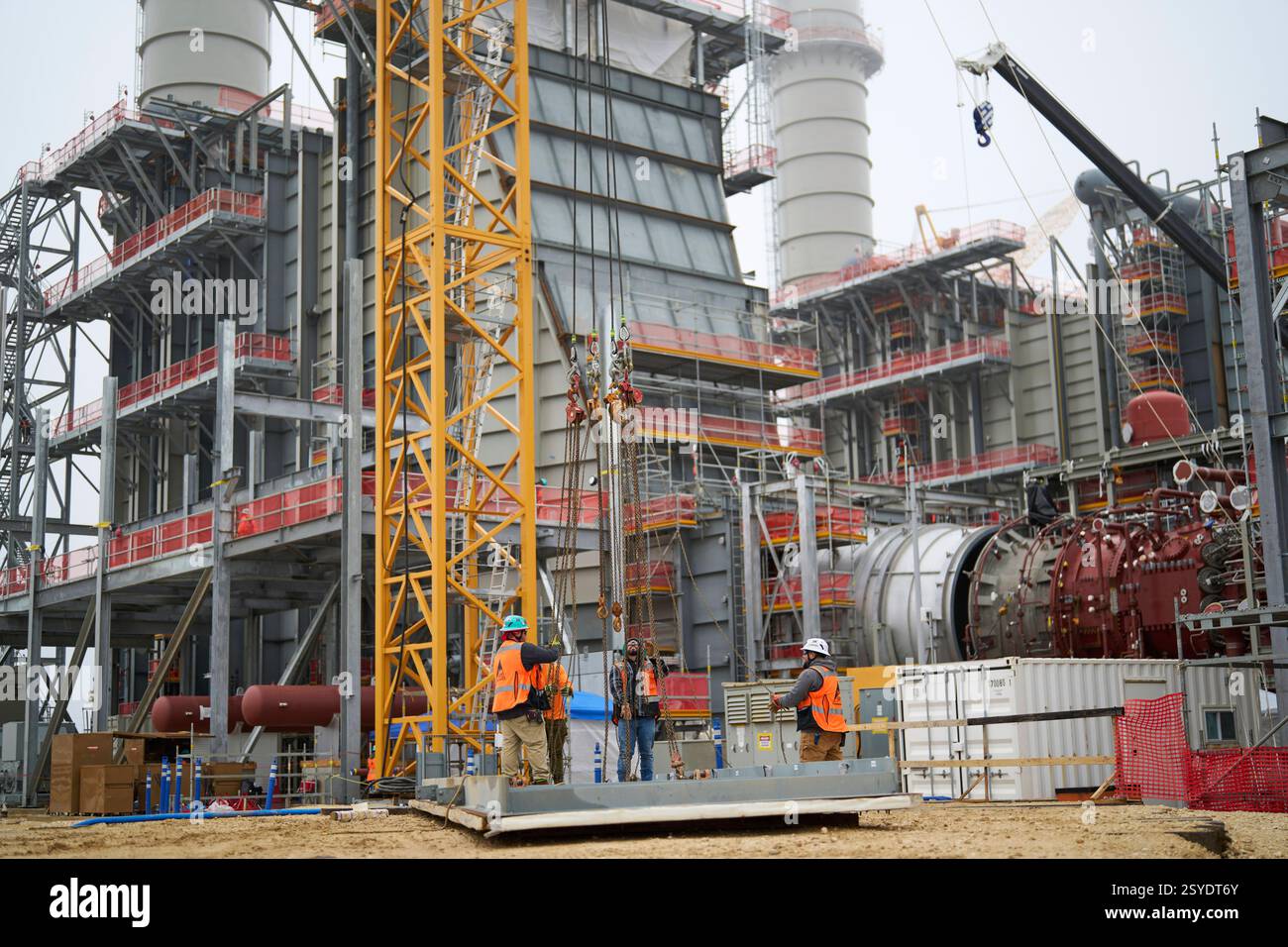 Workers prepare to move materials at Entergy's Orange County Advanced ...