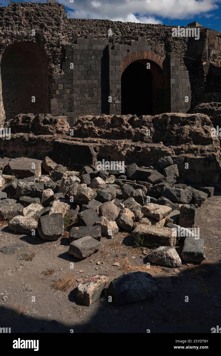 Blocks of black basalt lava stone from nearby Mount Etna faced the ...
