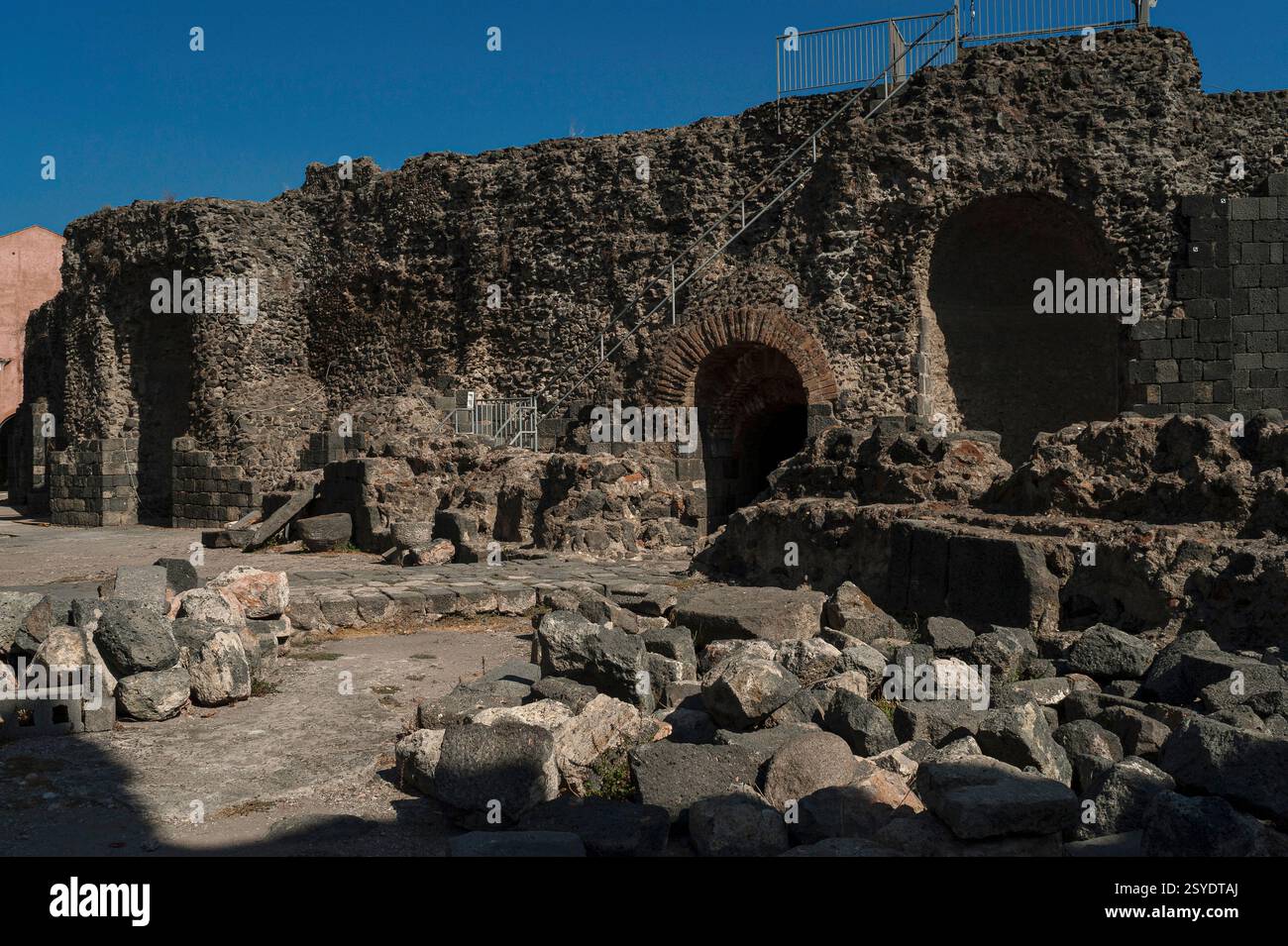 Blocks of basalt lava stone from eruptions of nearby Mount Etna faced ...