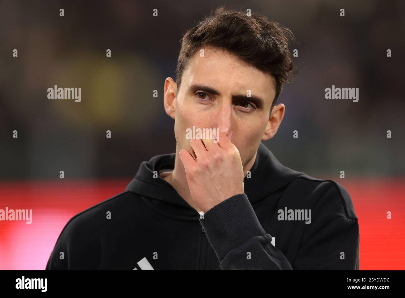 Turin, Italy. 26th Feb, 2025. Andrea Cambiaso of Juventus reacts as he looks on during the line ...