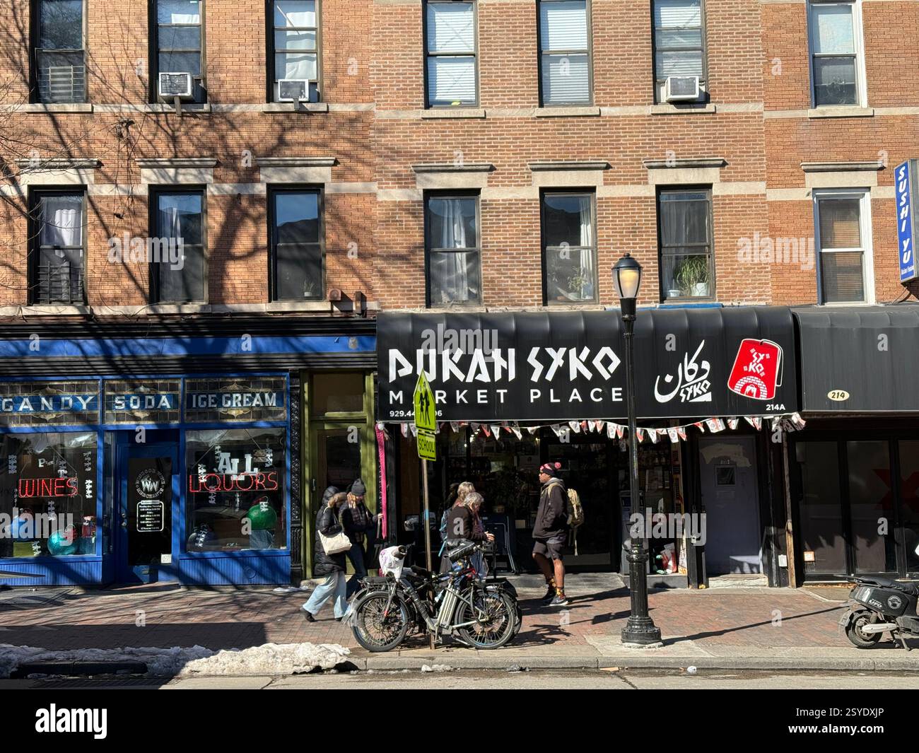 The south end of Prospect Park West , a commercial strip near 16th ...