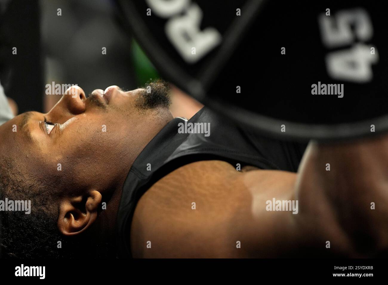 North Carolina defensive lineman Jahvaree Ritzie lifts weights at the ...