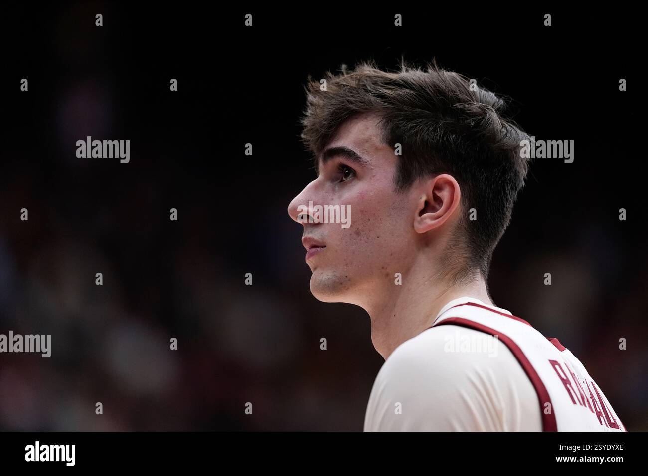 Stanford forward Maxime Raynaud looks up while standing on the court ...