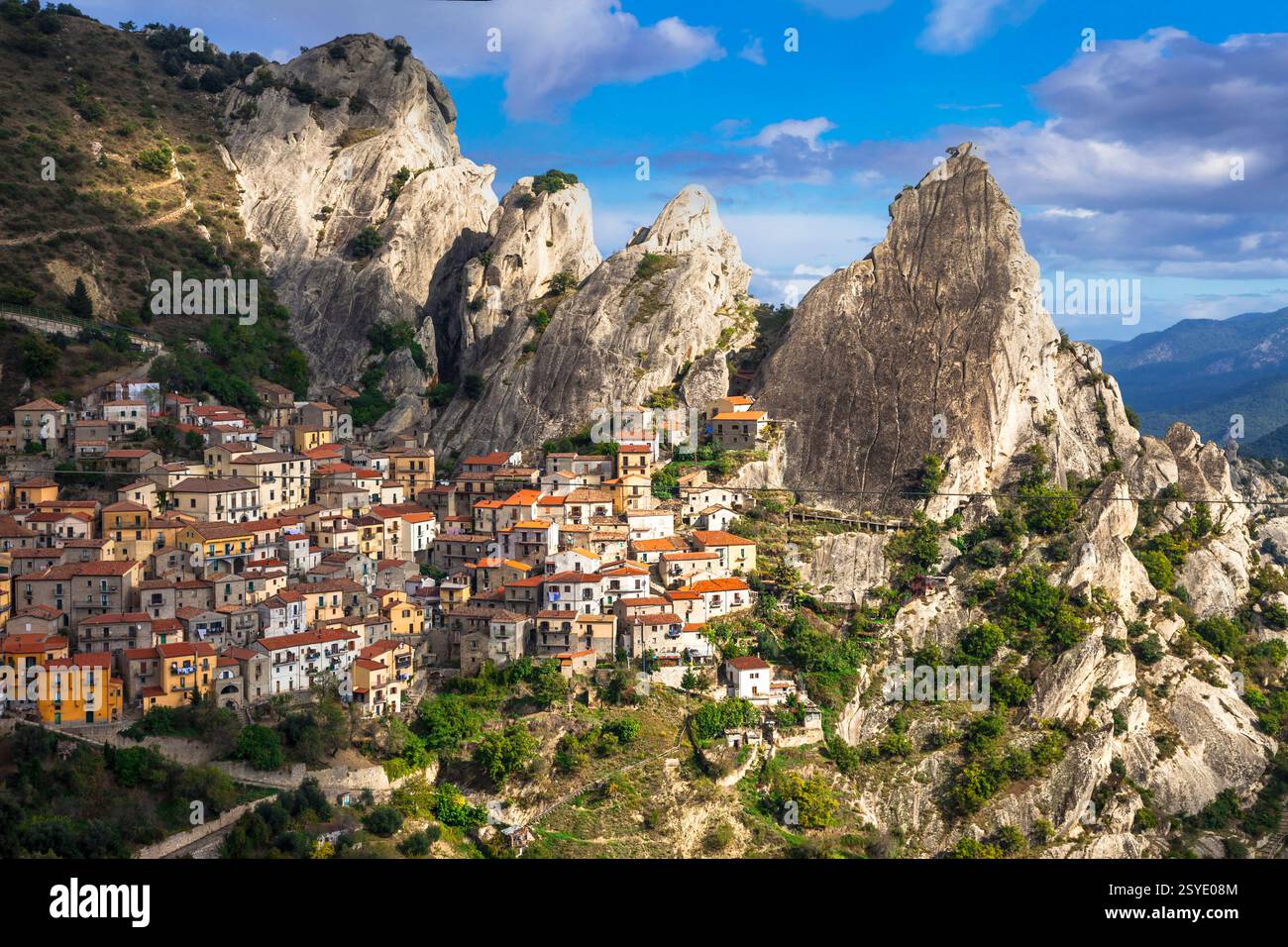 Colorful traditional village Castelmezzano, surrounded by rocky ...