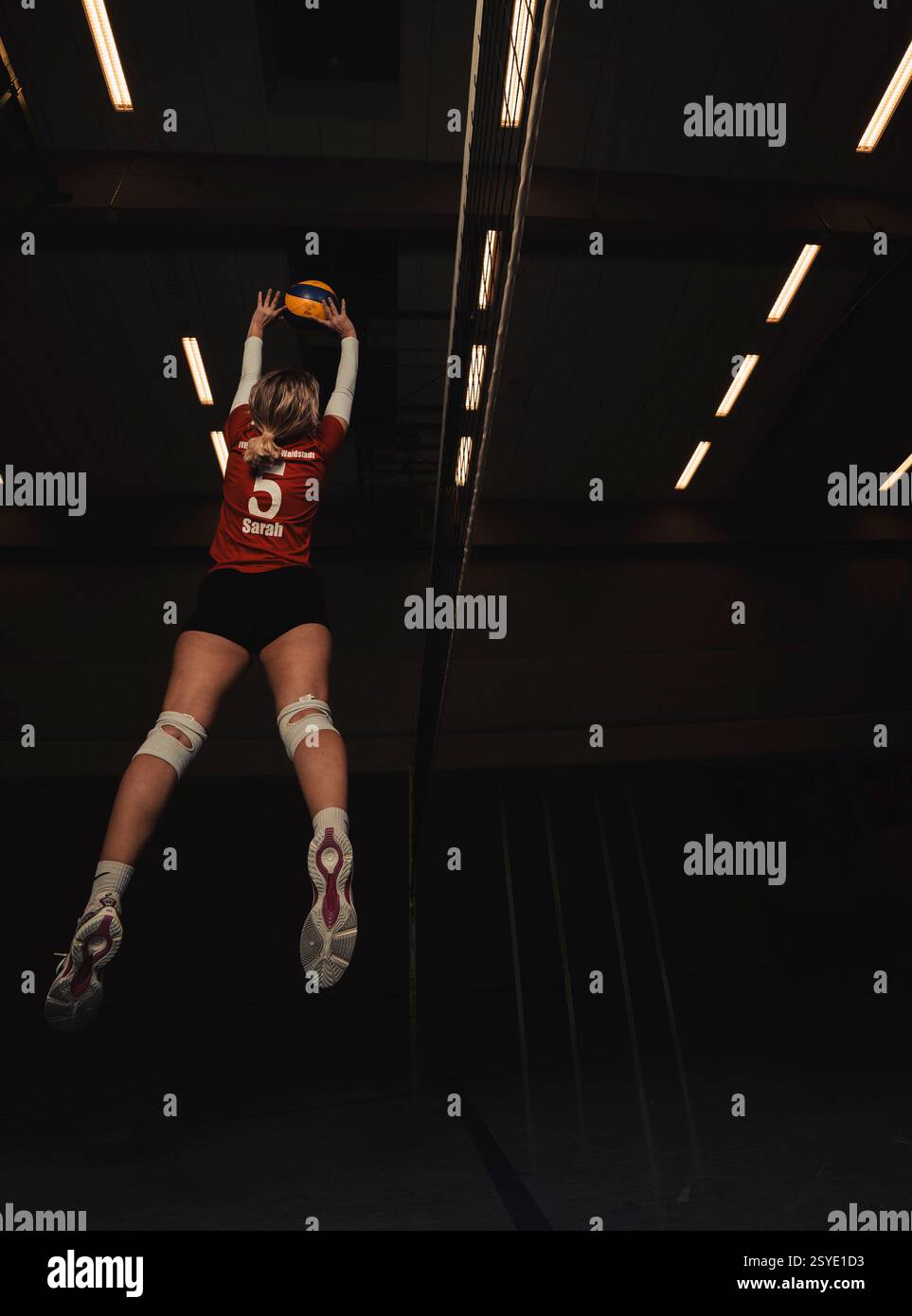 Aerial volleyball practice indoors with off camera flash Stock Photo ...
