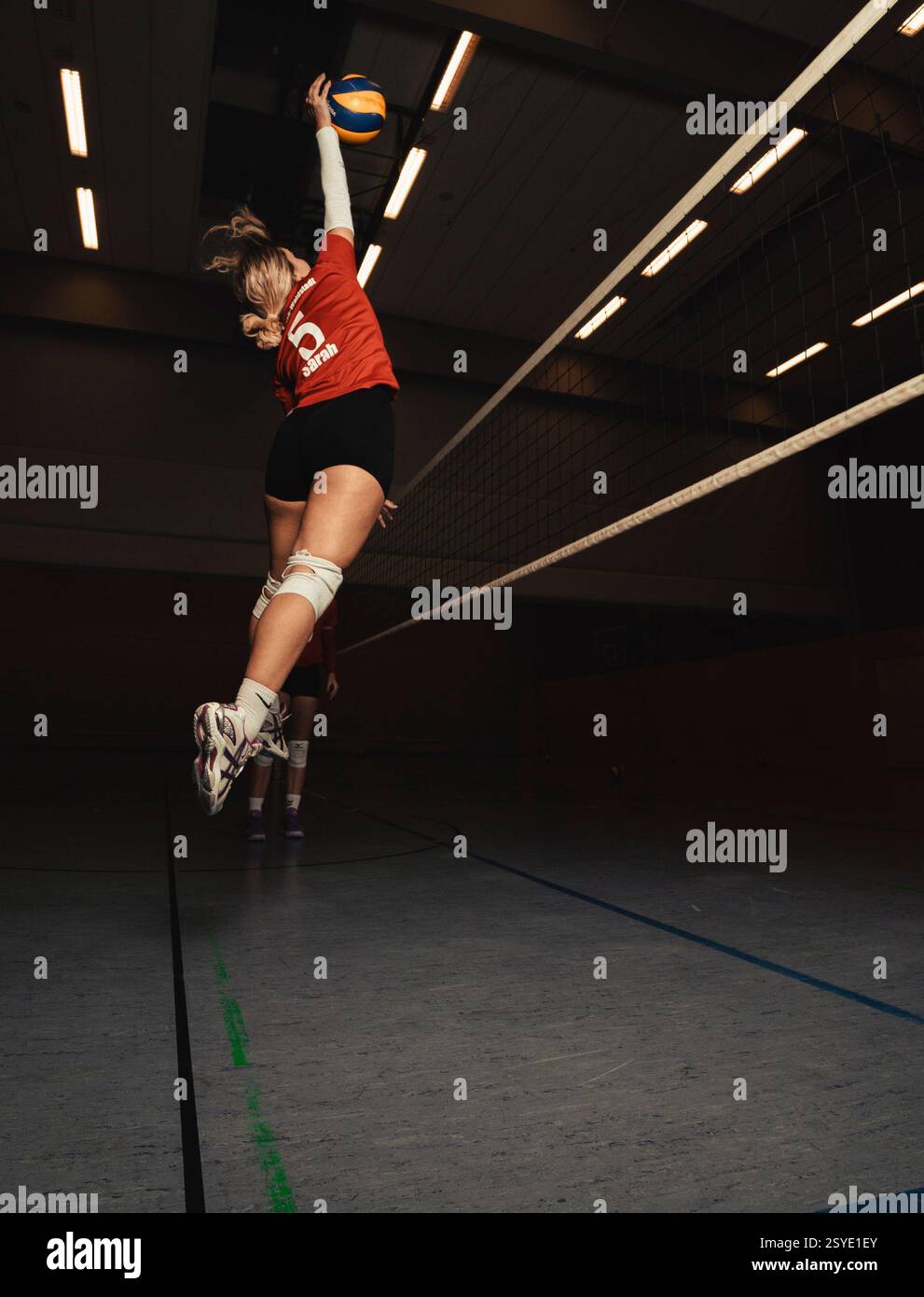 Aerial volleyball practice indoors with off camera flash Stock Photo ...