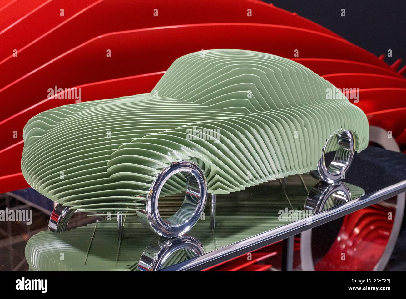 Sleek wave-inspired model car showcased at a design exhibition with ...