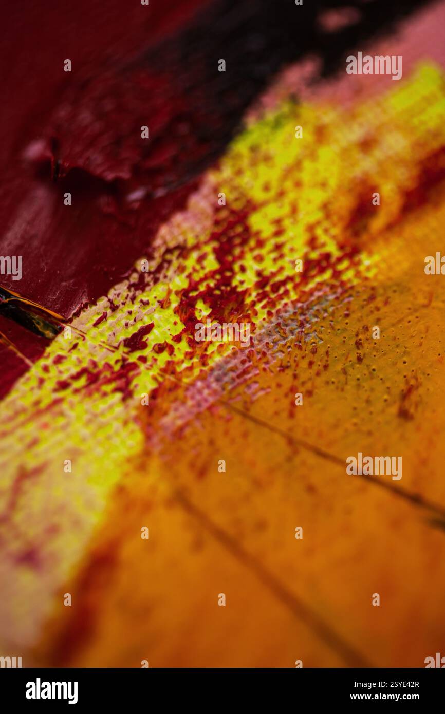 An intimate close-up shot of a canvas with a dynamic acrylic painting ...