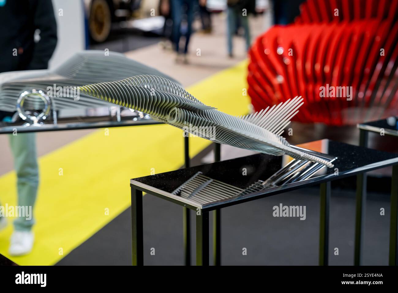 Sleek metallic fish sculpture on display in an art exhibition ...
