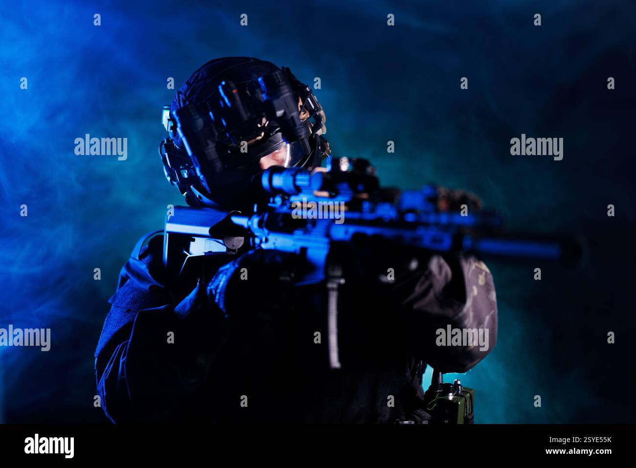 A tactical operator equipped with advanced gear aims with precision ...