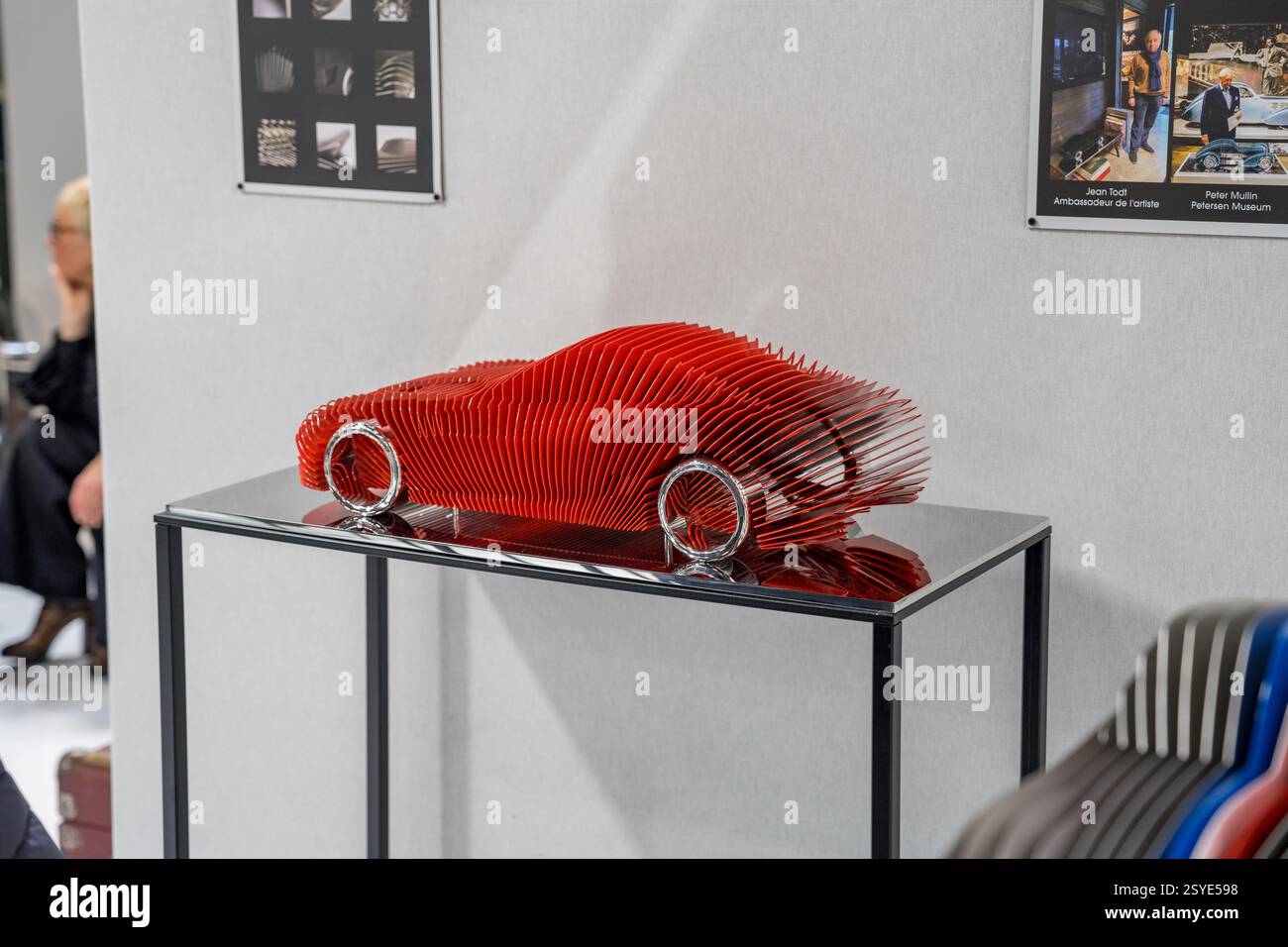 Innovative red sculpture captures the essence of modern automotive ...