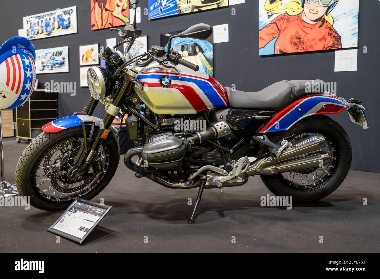 Classic motorcycle on display at an artistic automotive event featuring ...