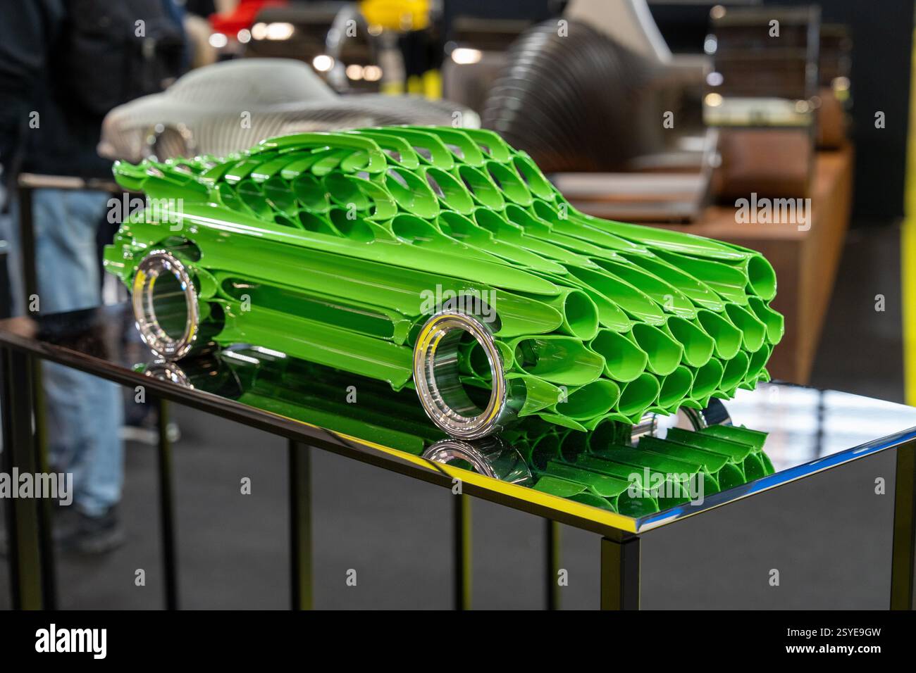 Unique green car model showcasing innovative design techniques at an ...