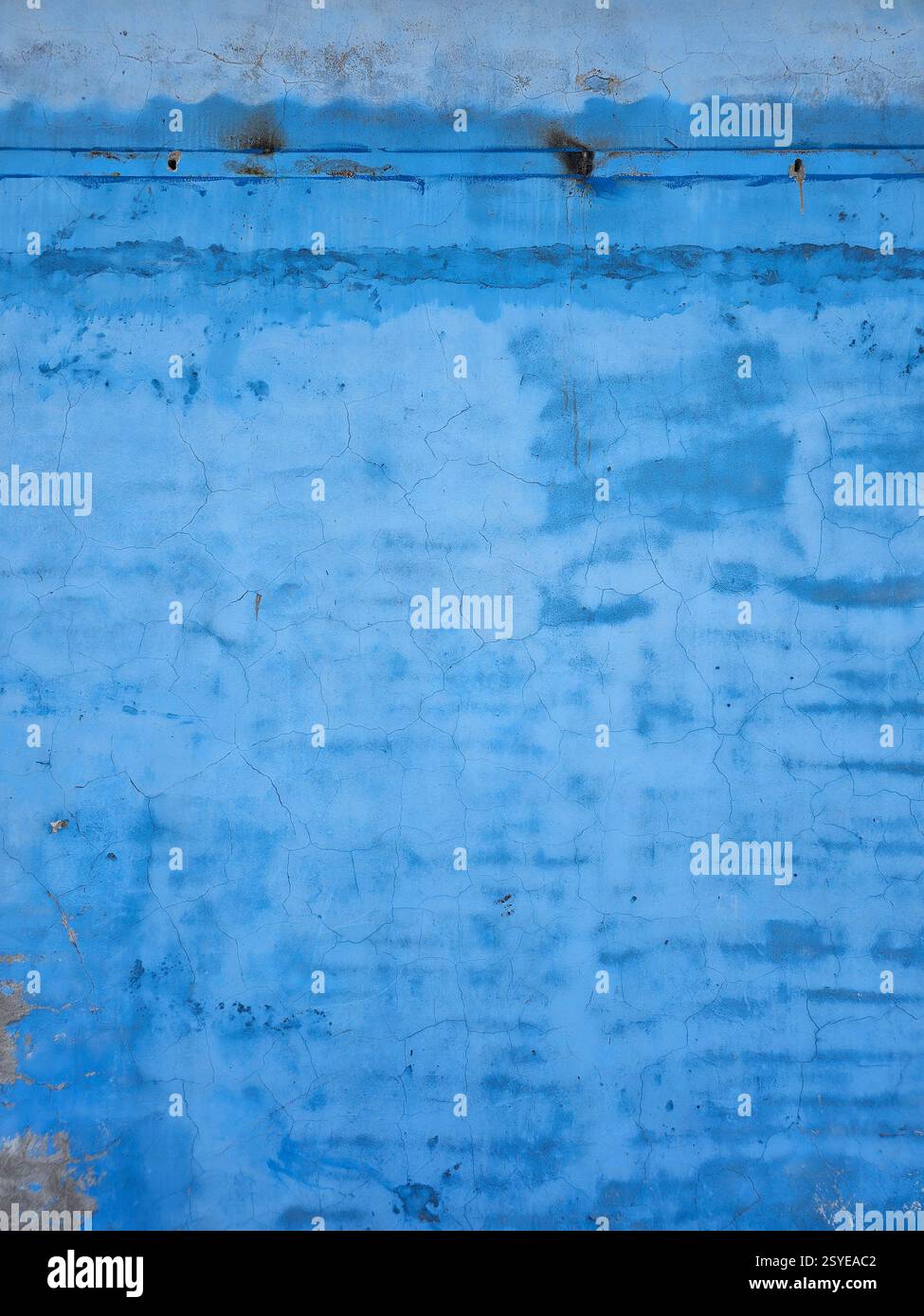 Rough faded away blue concrete wall surface pattern texture, peeled ...