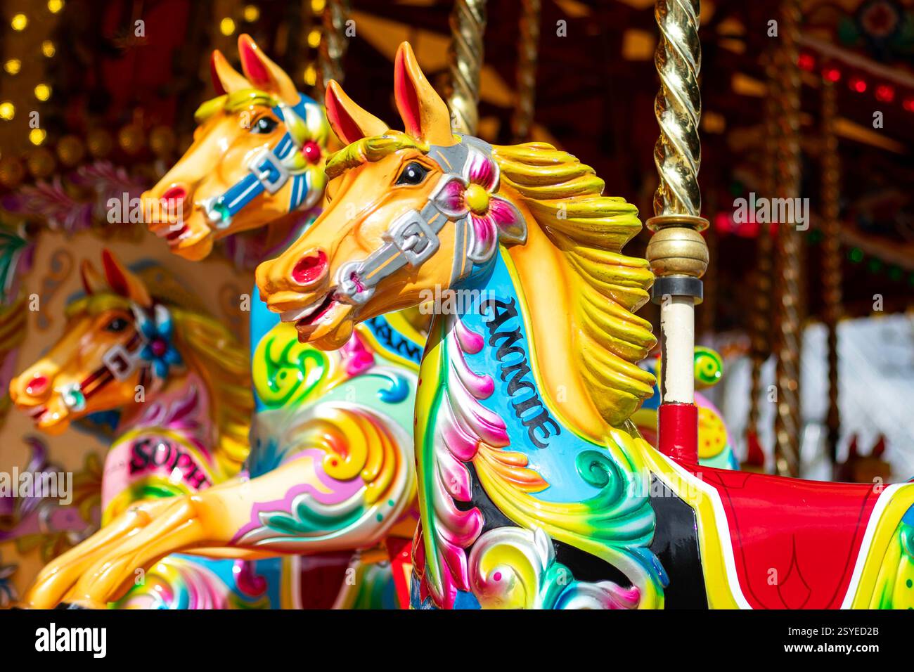 Vibrant Carousel Horses at a Traditional Fairground with name 'Annie ...