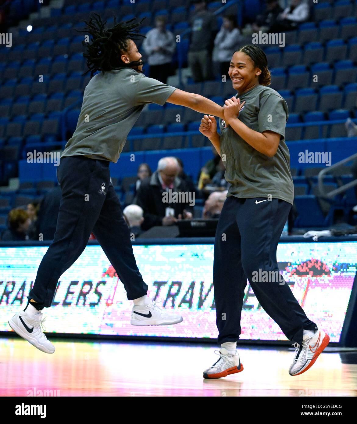 UConn guard KK Arnold, left, and UConn forward Sarah Strong, right ...
