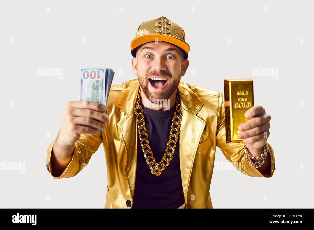 Funny and extravagant rich happy man in shining golden jacket, massive ...