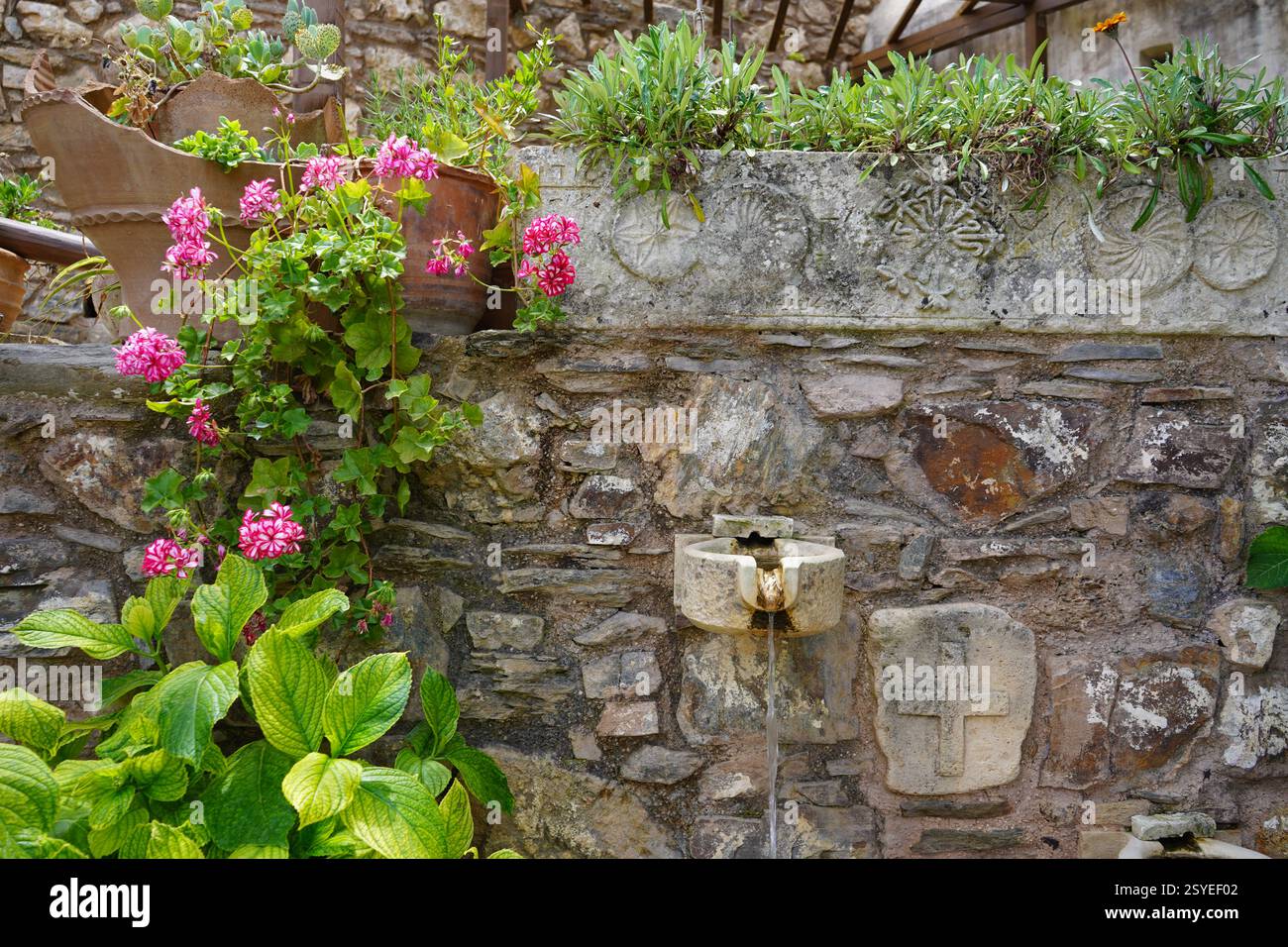 Beautiful flowers next to the fountains in the garden of the Monastery ...