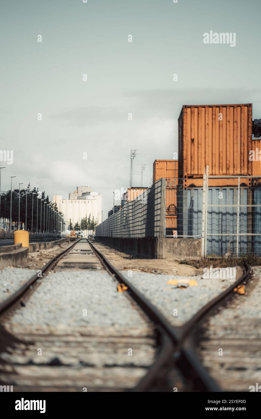 A vertical low-angle telephoto view of railway tracks splitting into ...